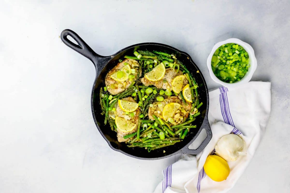 one pot lemon garlic pork chops and asparagus skillet meal