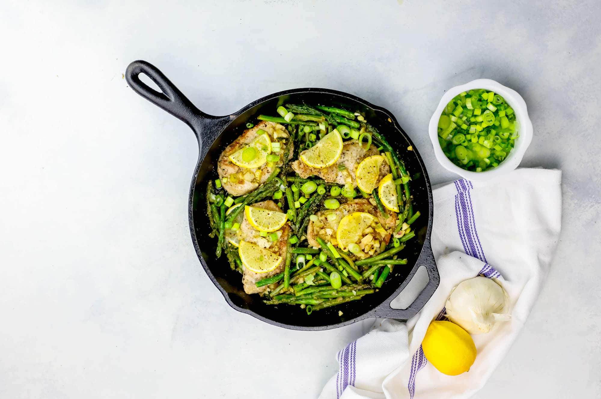 one pot lemon garlic pork chops and asparagus skillet meal